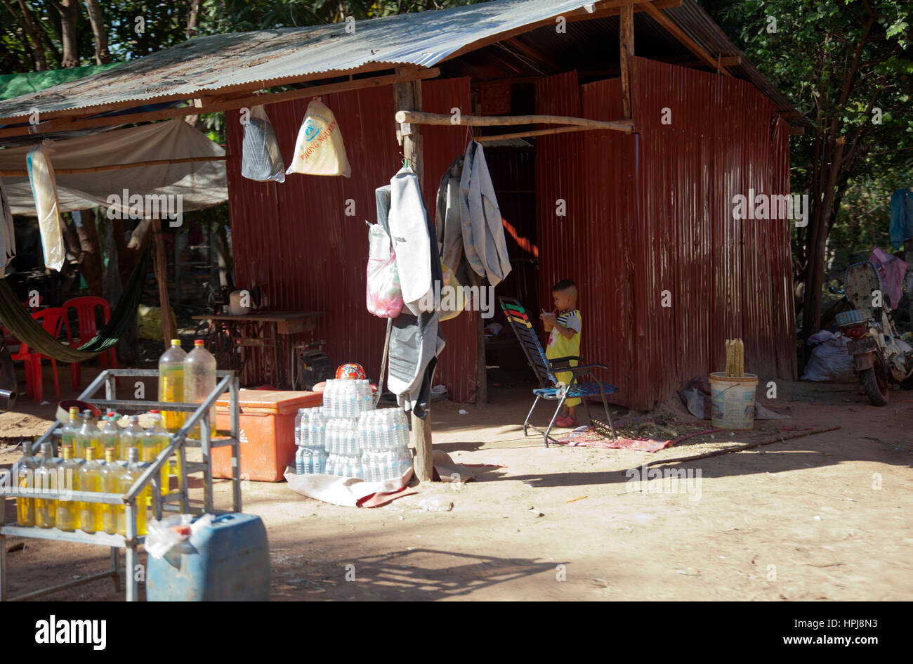 Preah Dak Village House with Boy in Siem Reap - Cambodia Stock Photo ...