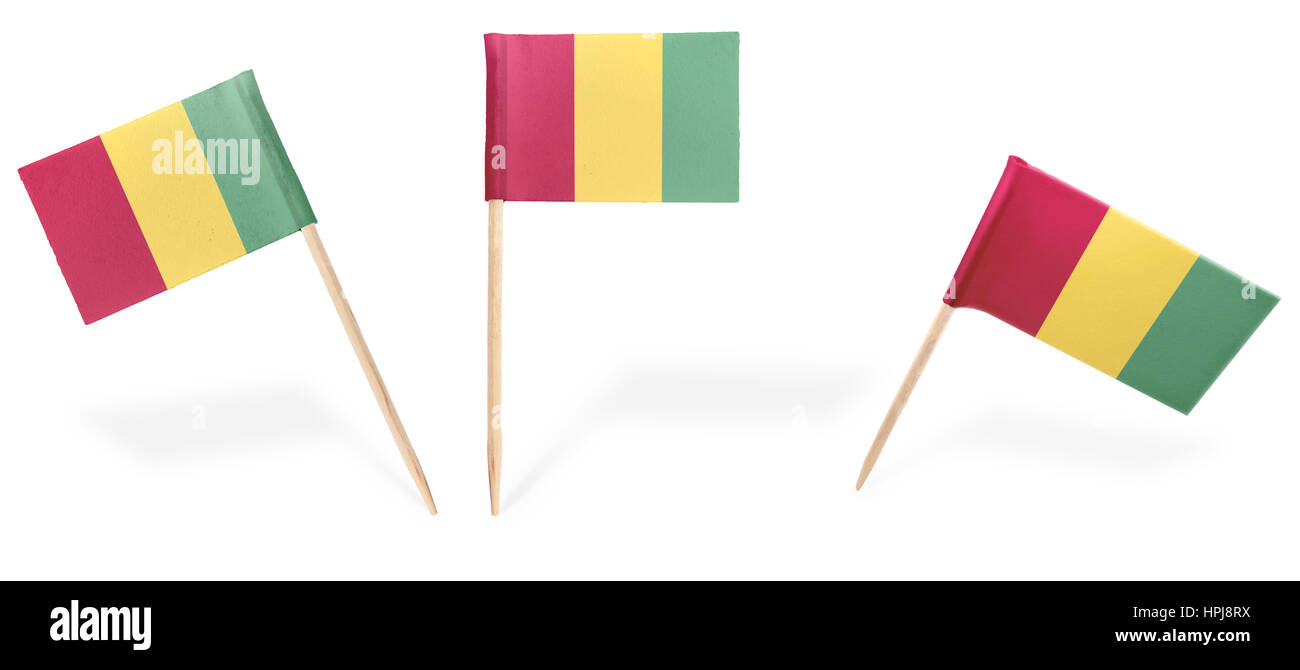 Small cocktail flags of Guinea in different positions isolated on white ...