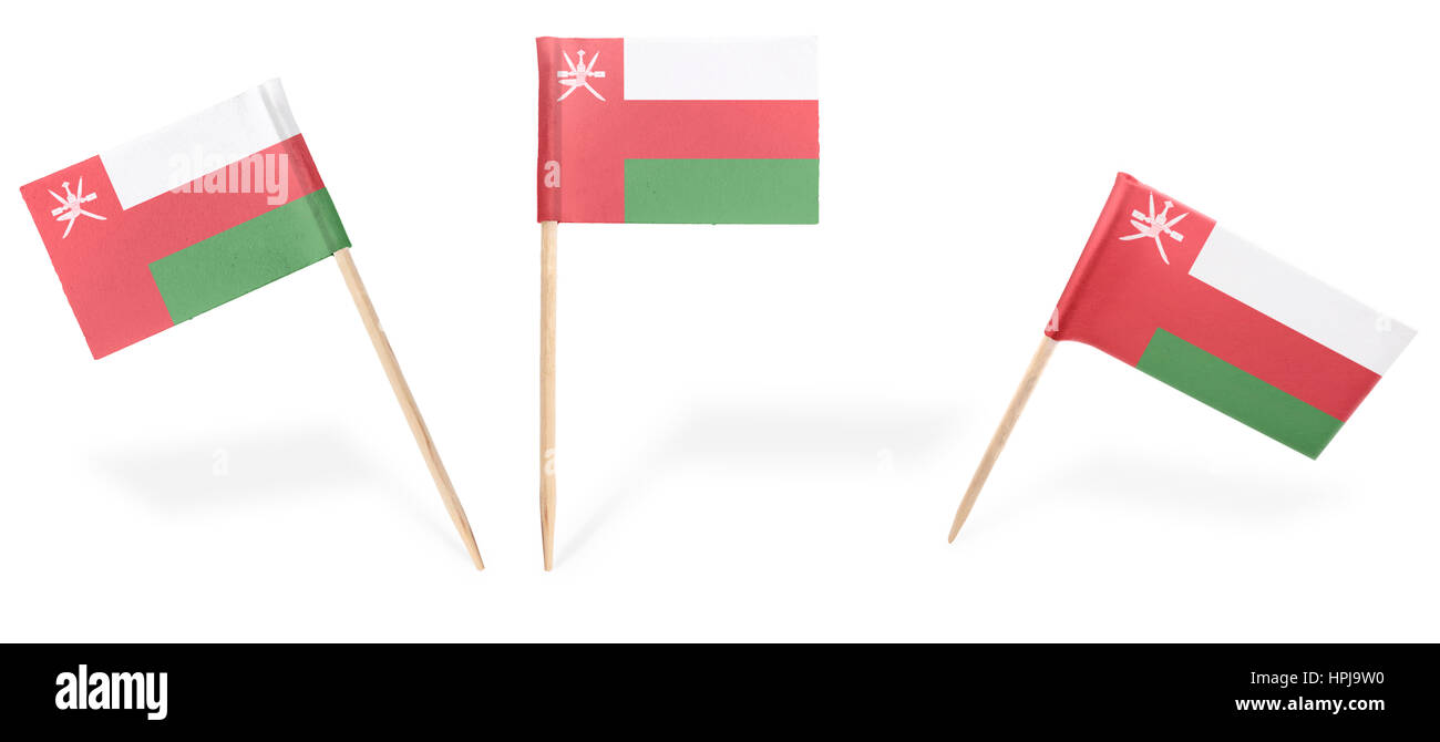 Small cocktail flags of Oman in different positions isolated on white ...