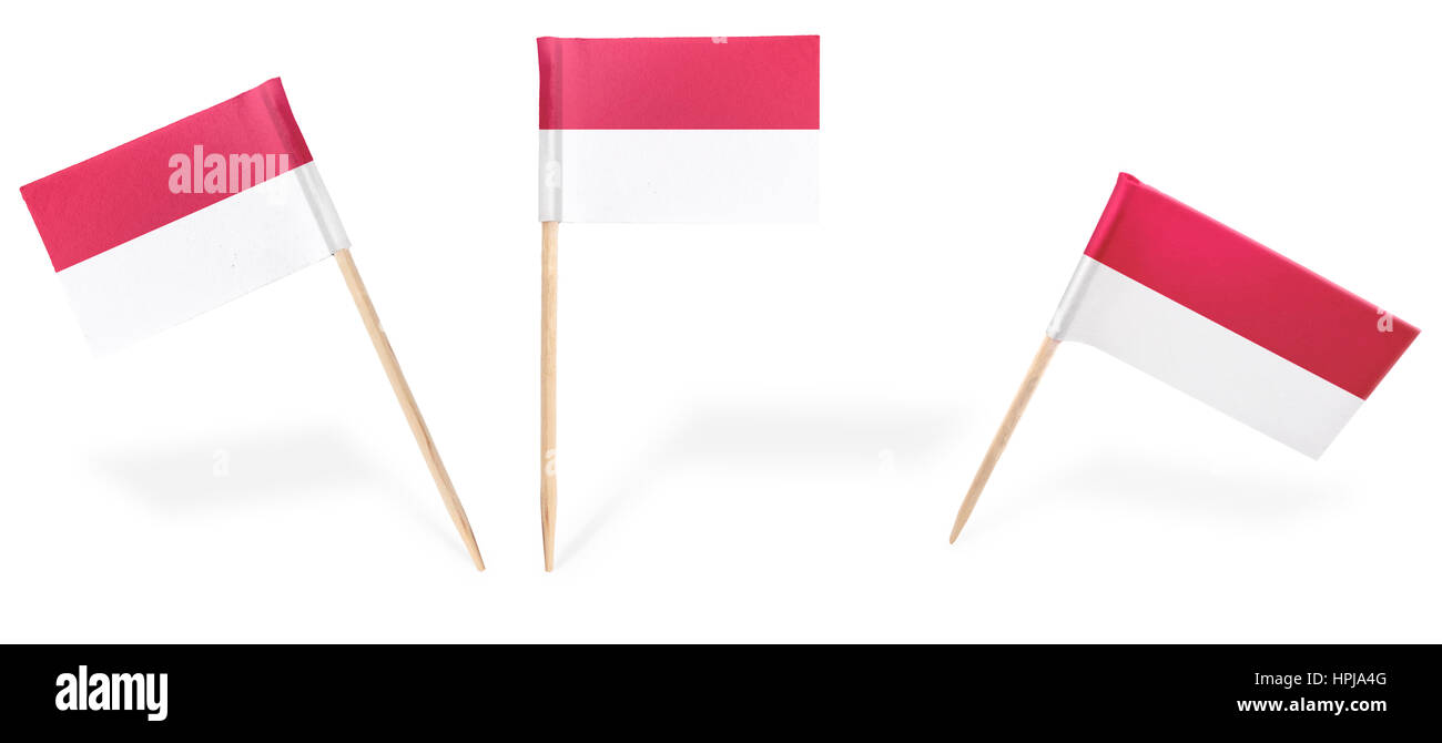 Small cocktail flags of Monaco in different positions isolated on white ...