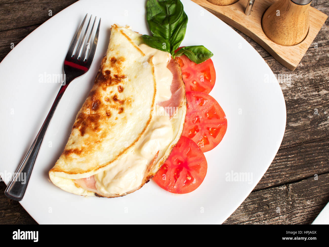 Folded omelette with cream cheese and ham for breakfast Stock Photo - Alamy