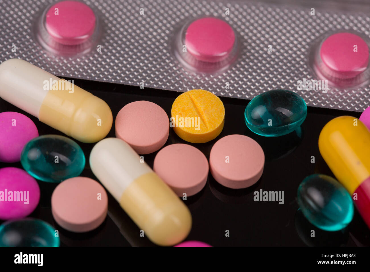 different tablets pills capsule heap mix therapy drugs Stock Photo - Alamy
