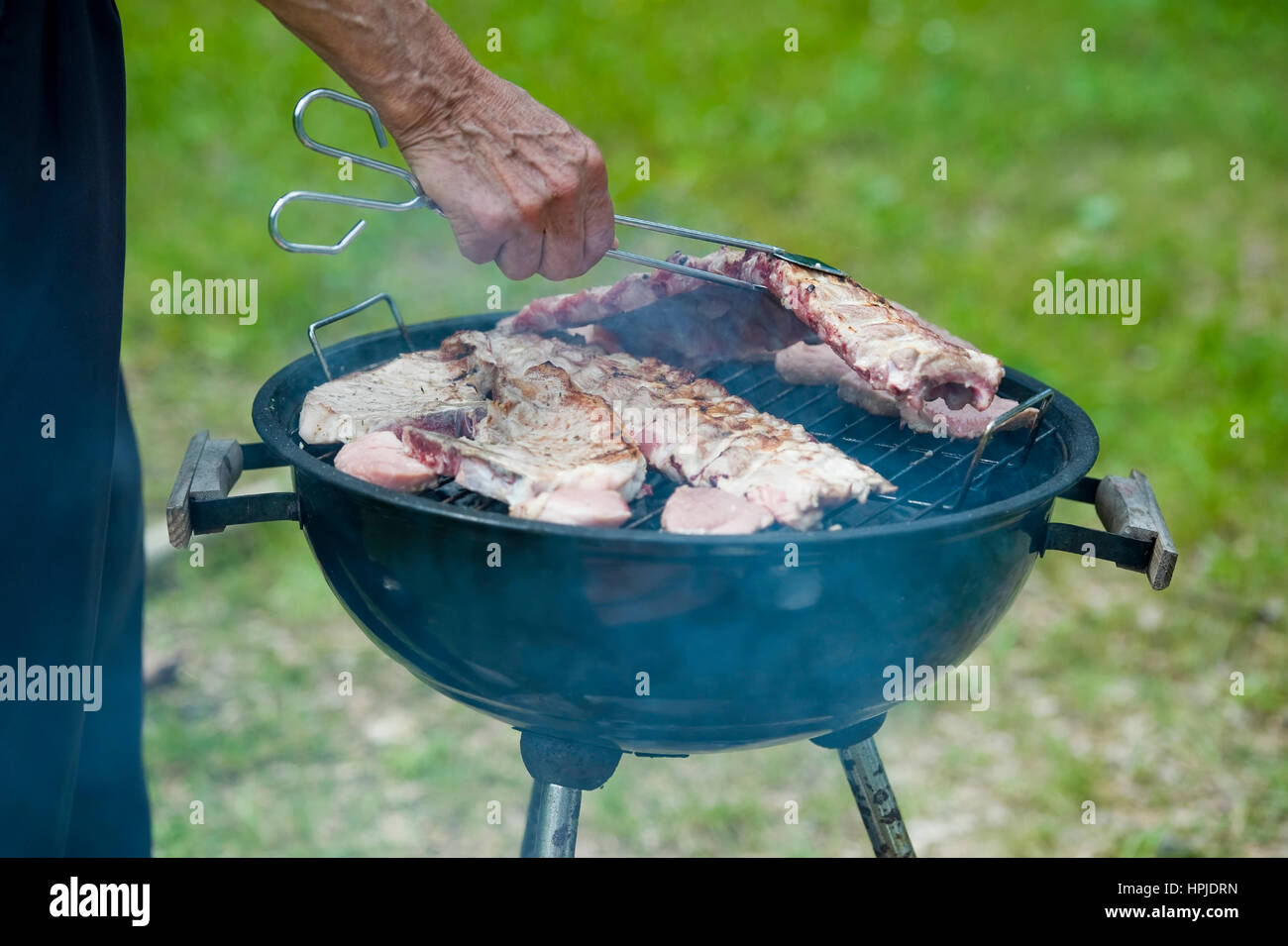 Fleisch am Griller - meat on barbecue Stock Photo - Alamy