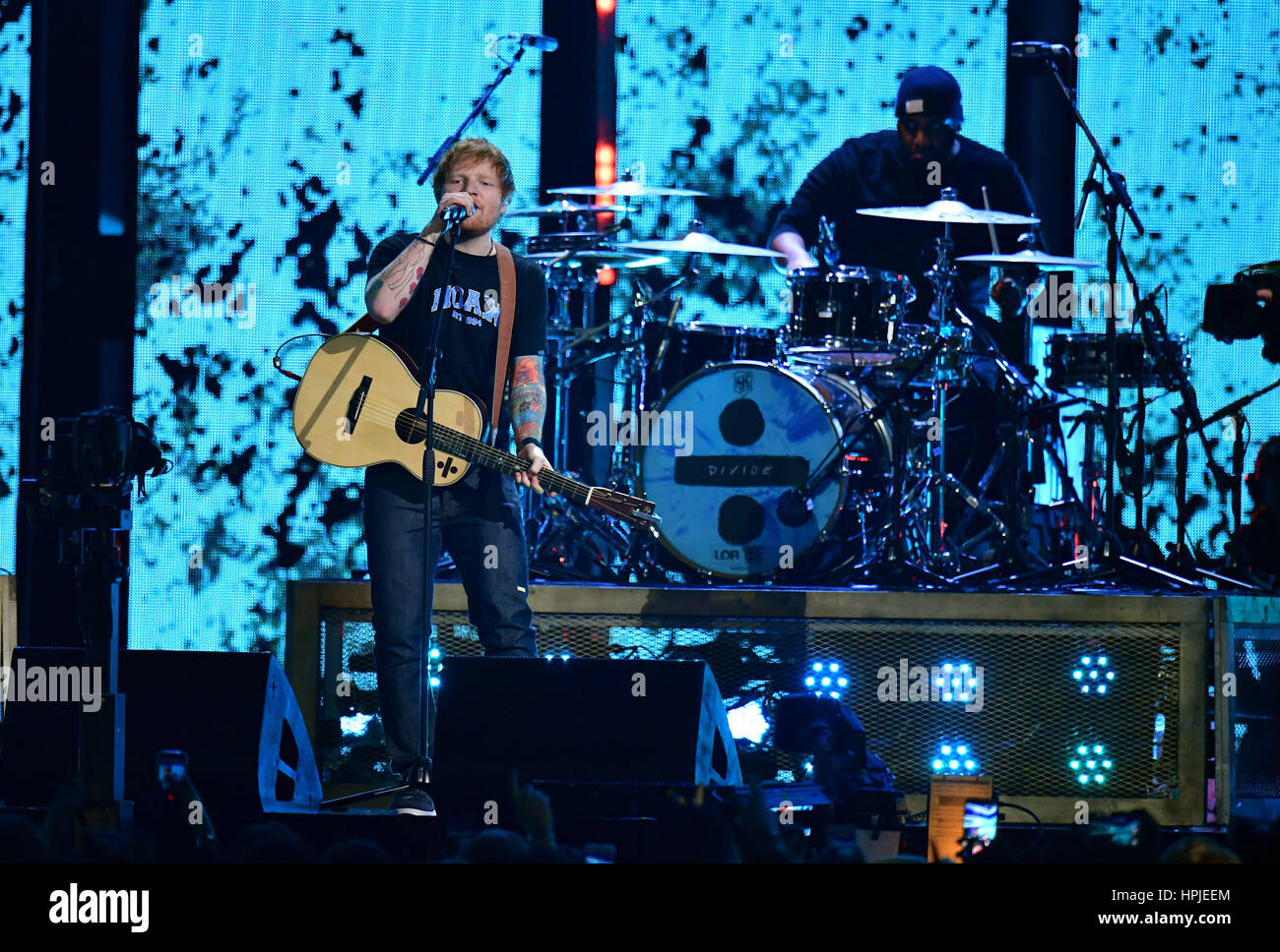 Ed Sheeran performing on stage at the Brit Awards at the O2 Arena ...