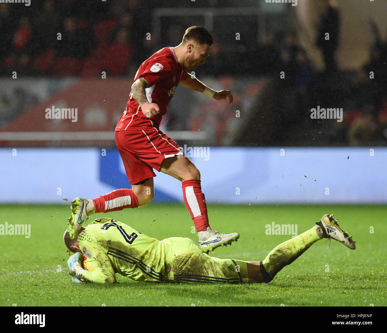 Bristol City's Matty Taylor jumps over Fulham goalkeeper David Button ...
