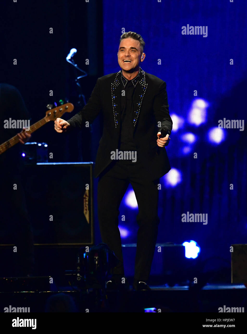 Robbie Williams performs on stage at the Brit Awards at the O2 Arena ...