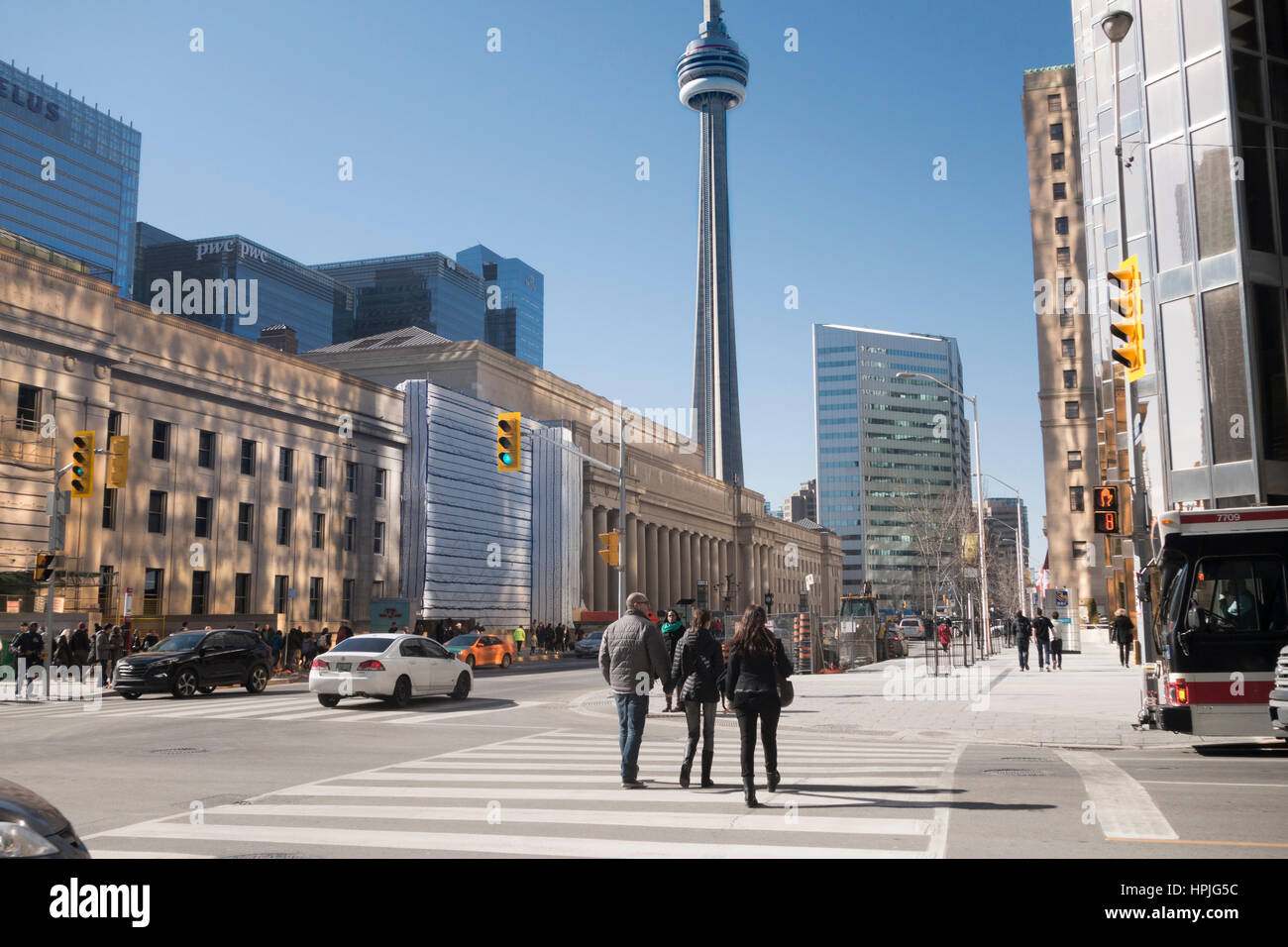 People going through a crosswalk at Front and Bay St. by Union Station ...