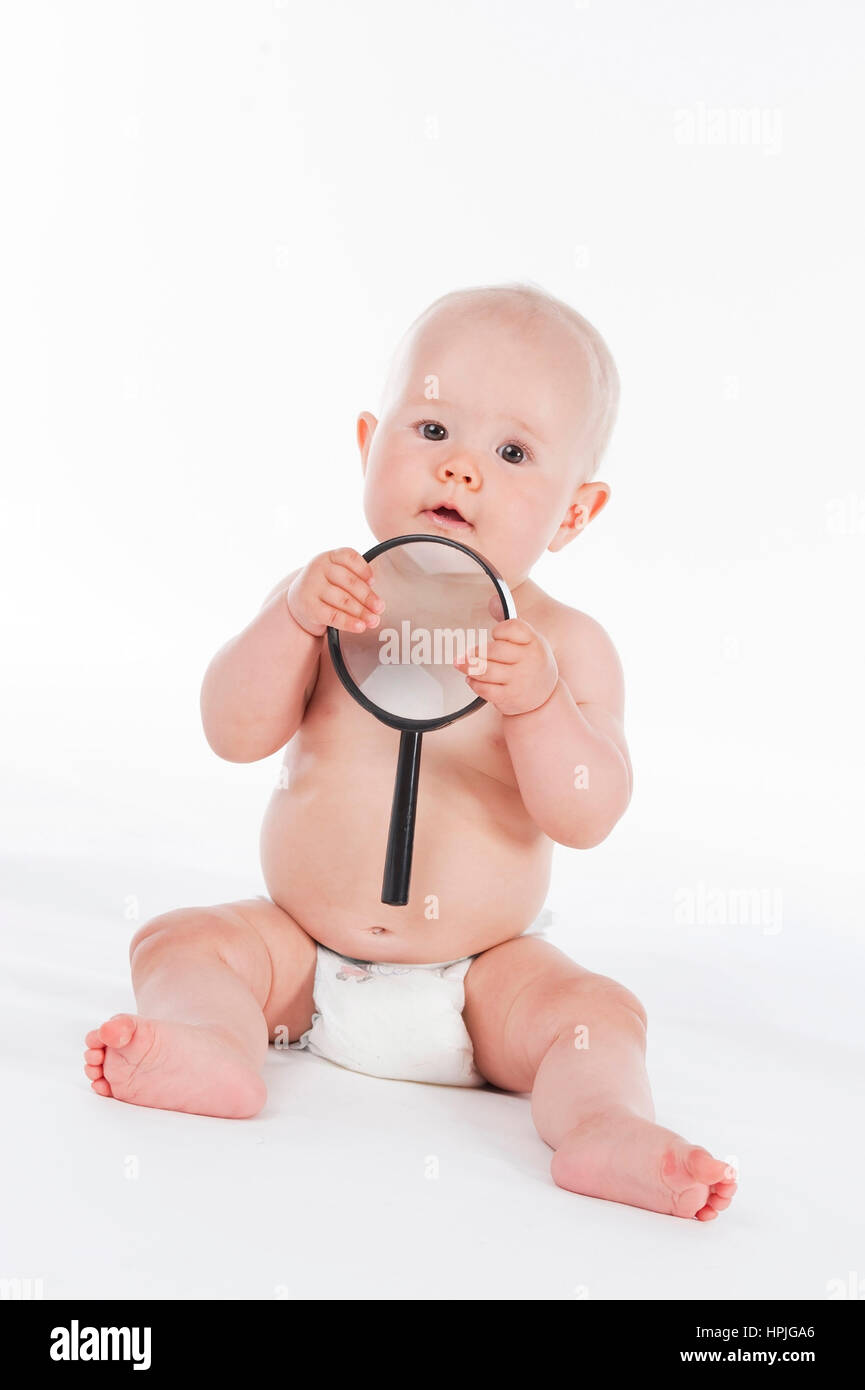 Model released , Baby, 10 Monate, mit Lupe - little child with loupe ...