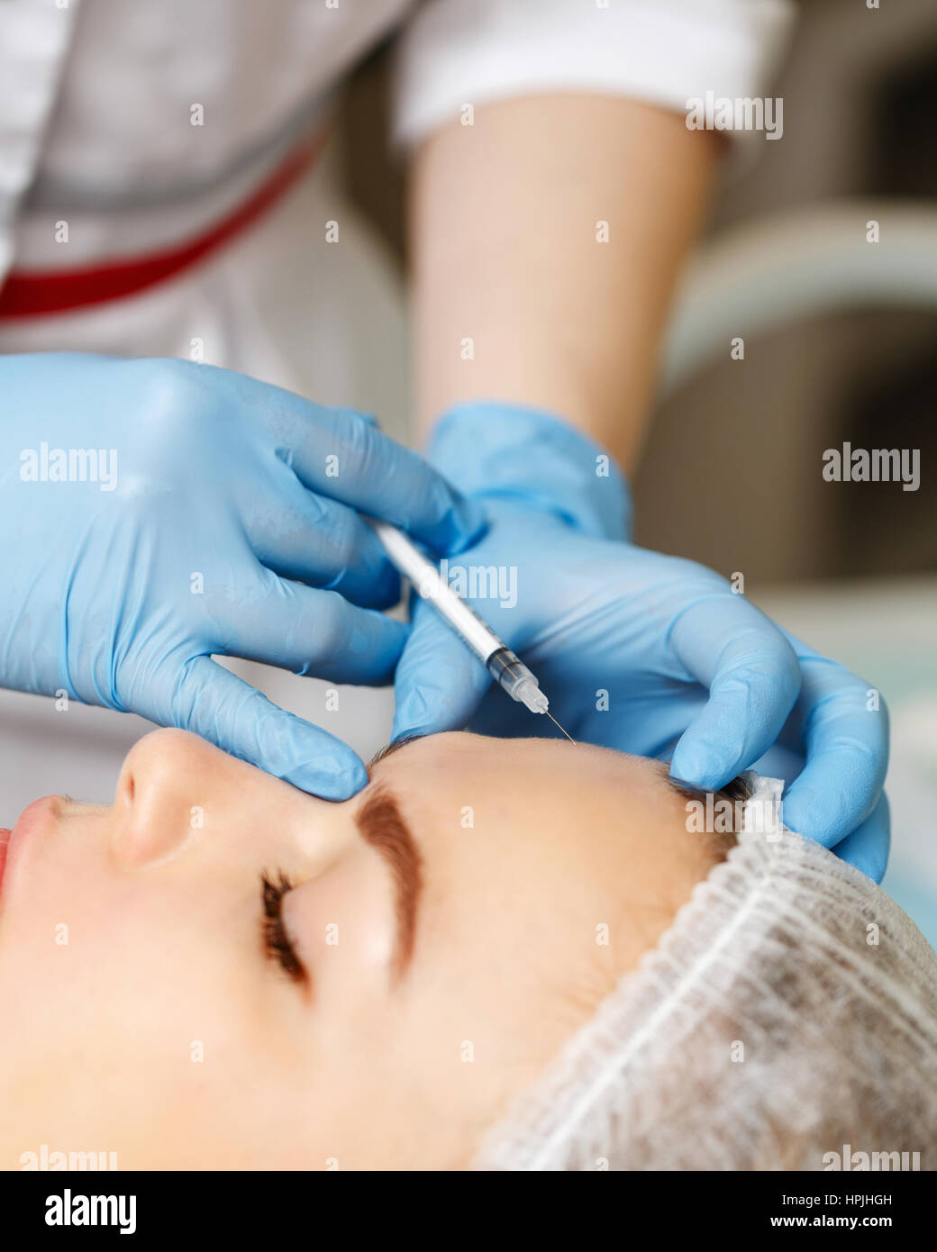 Injections under the skin. The injection into the skin of the forehead ...