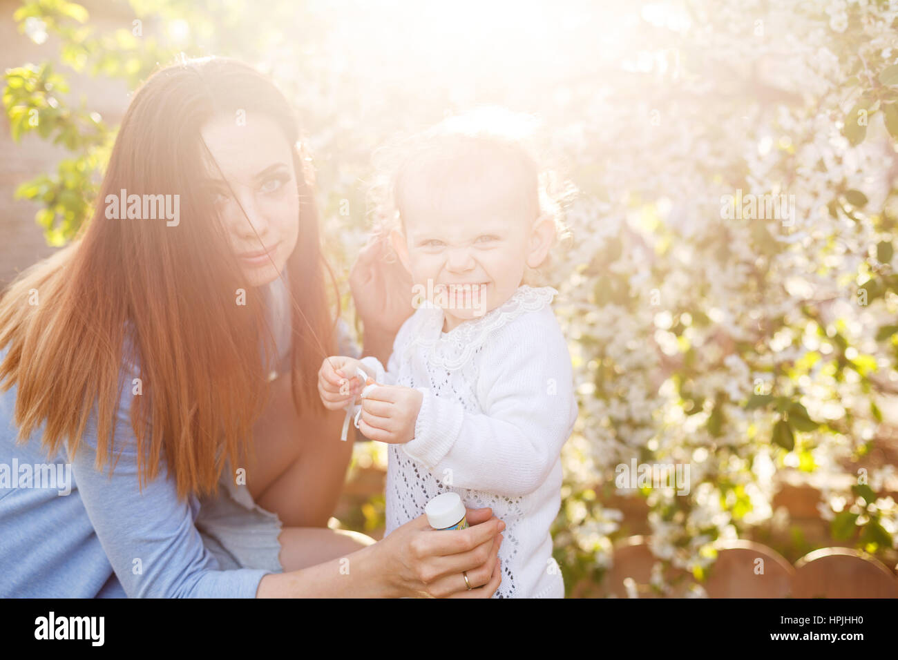 Mother and daughter. Family portrait in backlight. Spring mood Stock ...