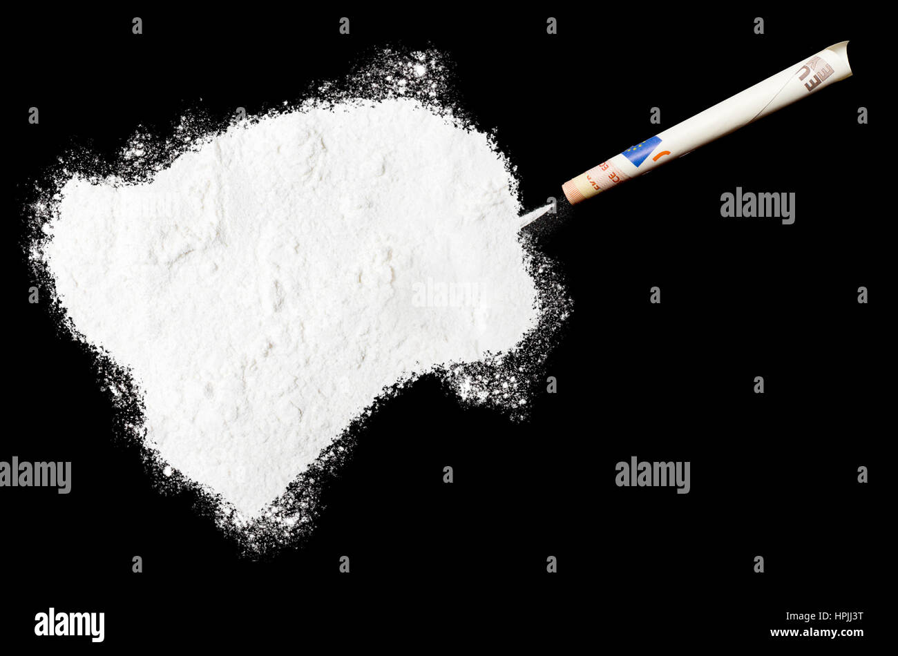A powder drug like cocaine in the shape of Guinea-Bissau with a rolled ...