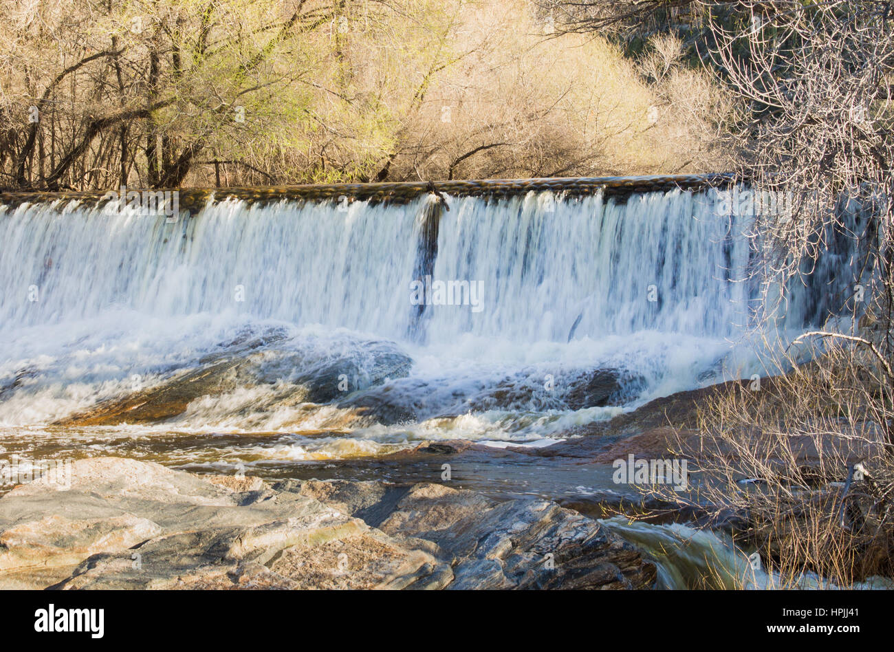 Dam spilling over Stock Photo - Alamy