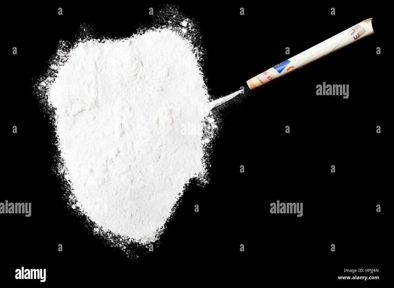 A powder drug like cocaine in the shape of Sierra Leone with a rolled ...