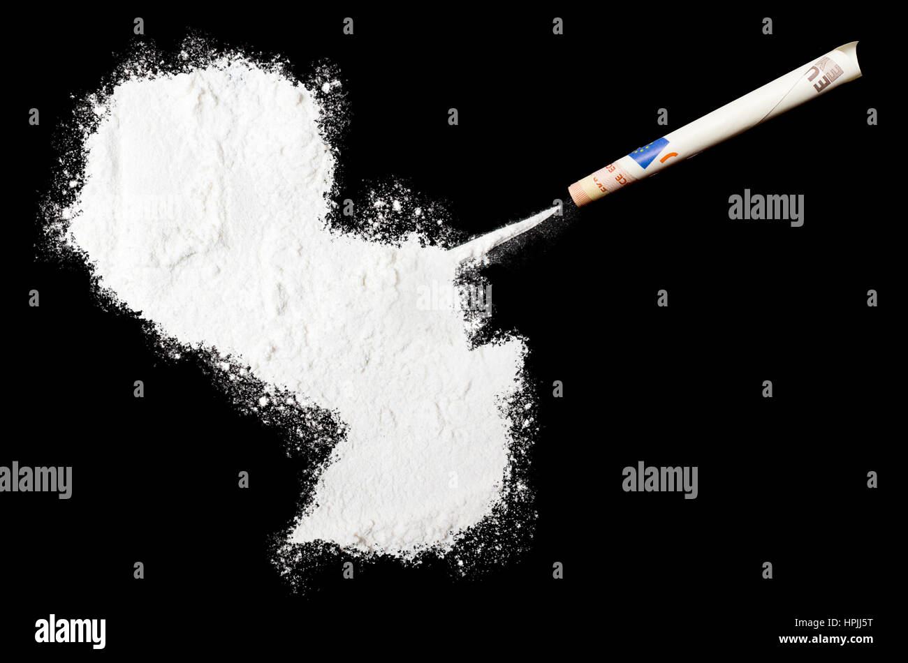 A powder drug like cocaine in the shape of Paraguay with a rolled money ...