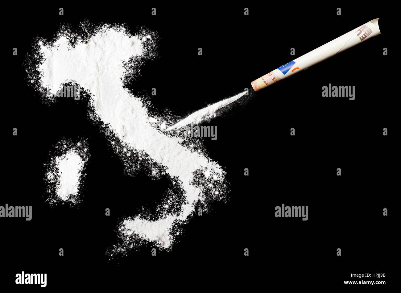 A powder drug like cocaine in the shape of Italy with a rolled money ...
