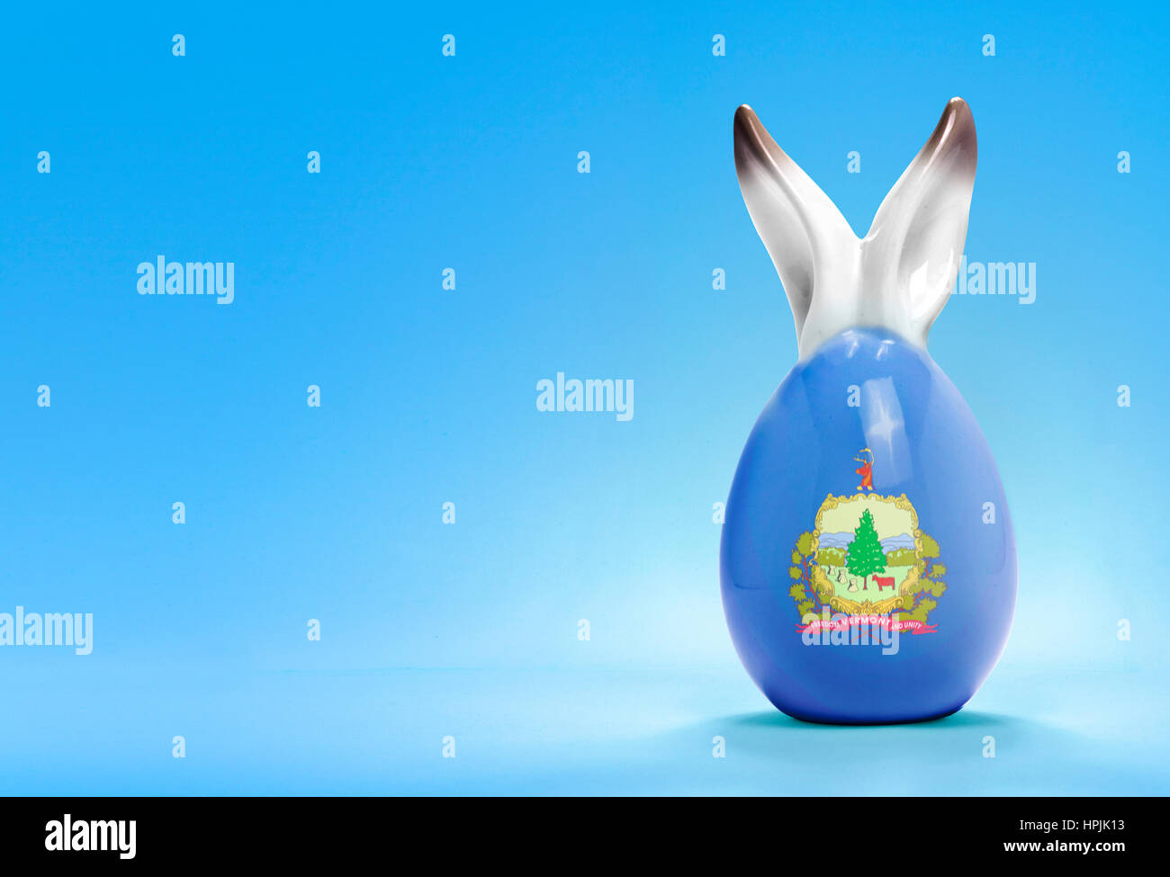 Colorful cute ceramic easter egg with rabbit ears and the flag of ...