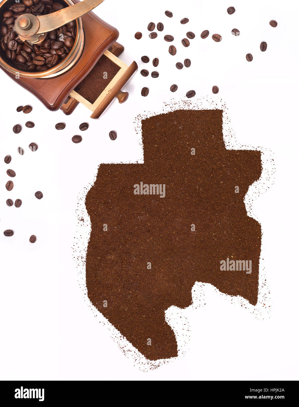 Coffee powder in the shape of Gabon and a decorative coffee mill ...