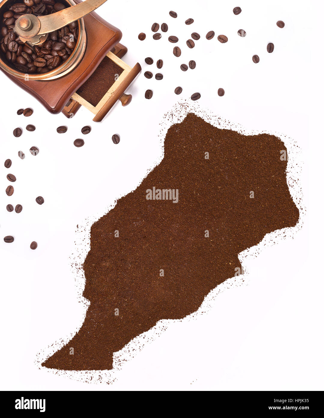 Coffee powder in the shape of Morocco and a decorative coffee mill ...