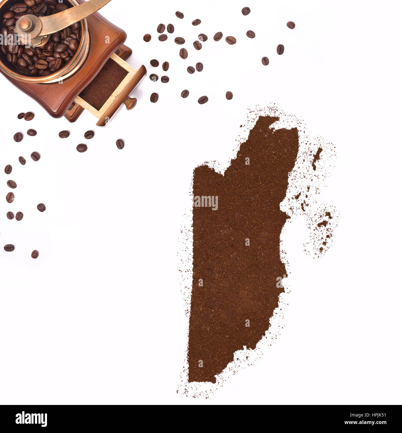 Coffee powder in the shape of Belize and a decorative coffee mill ...