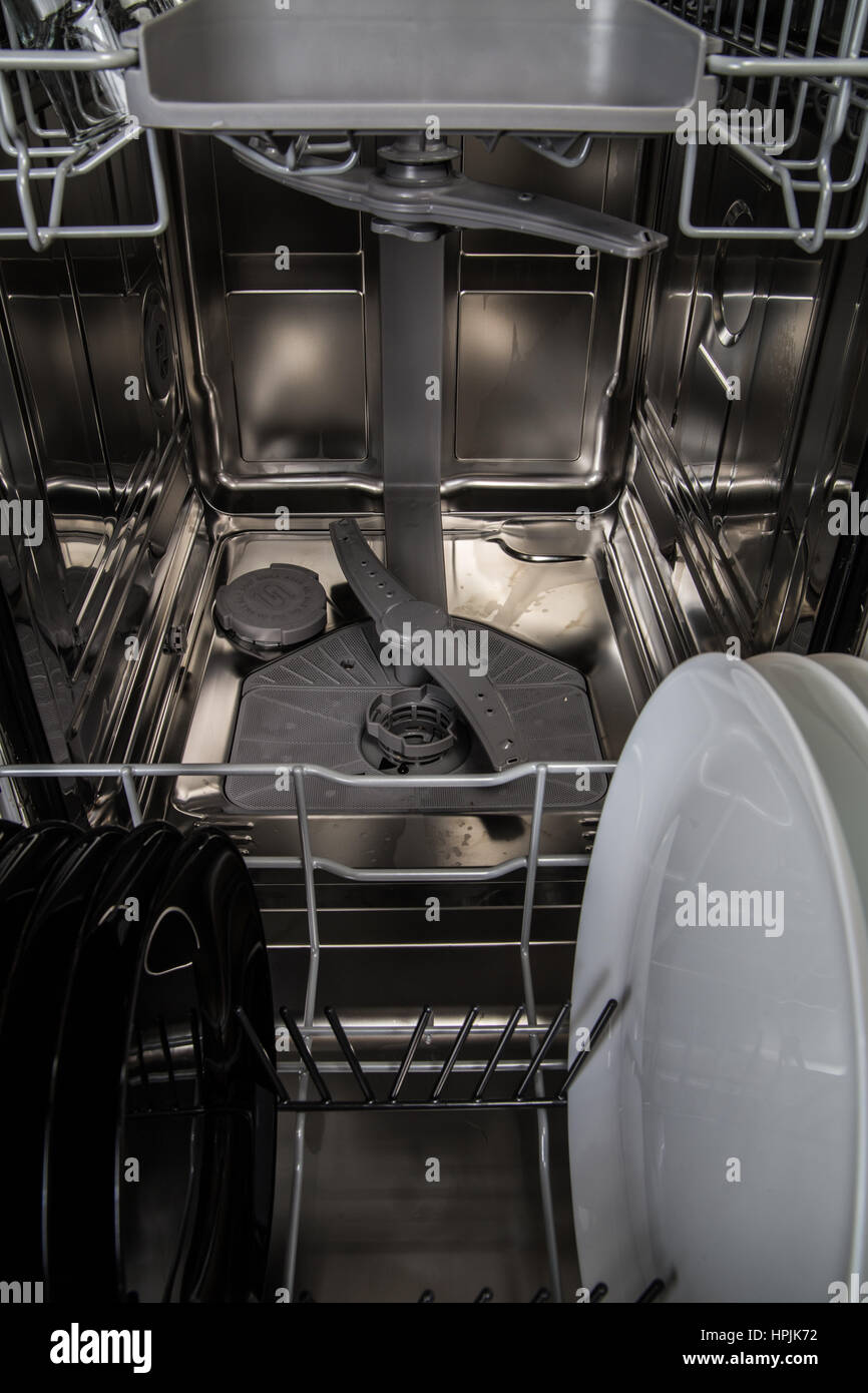 Clean dishes in a modern dishwasher machine Stock Photo - Alamy