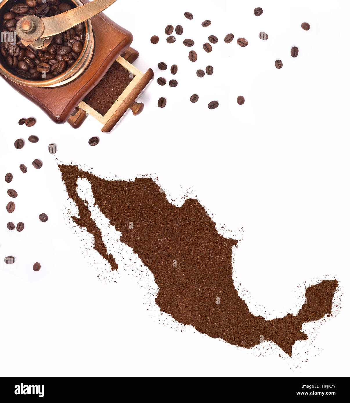 Coffee powder in the shape of Mexico and a decorative coffee mill ...