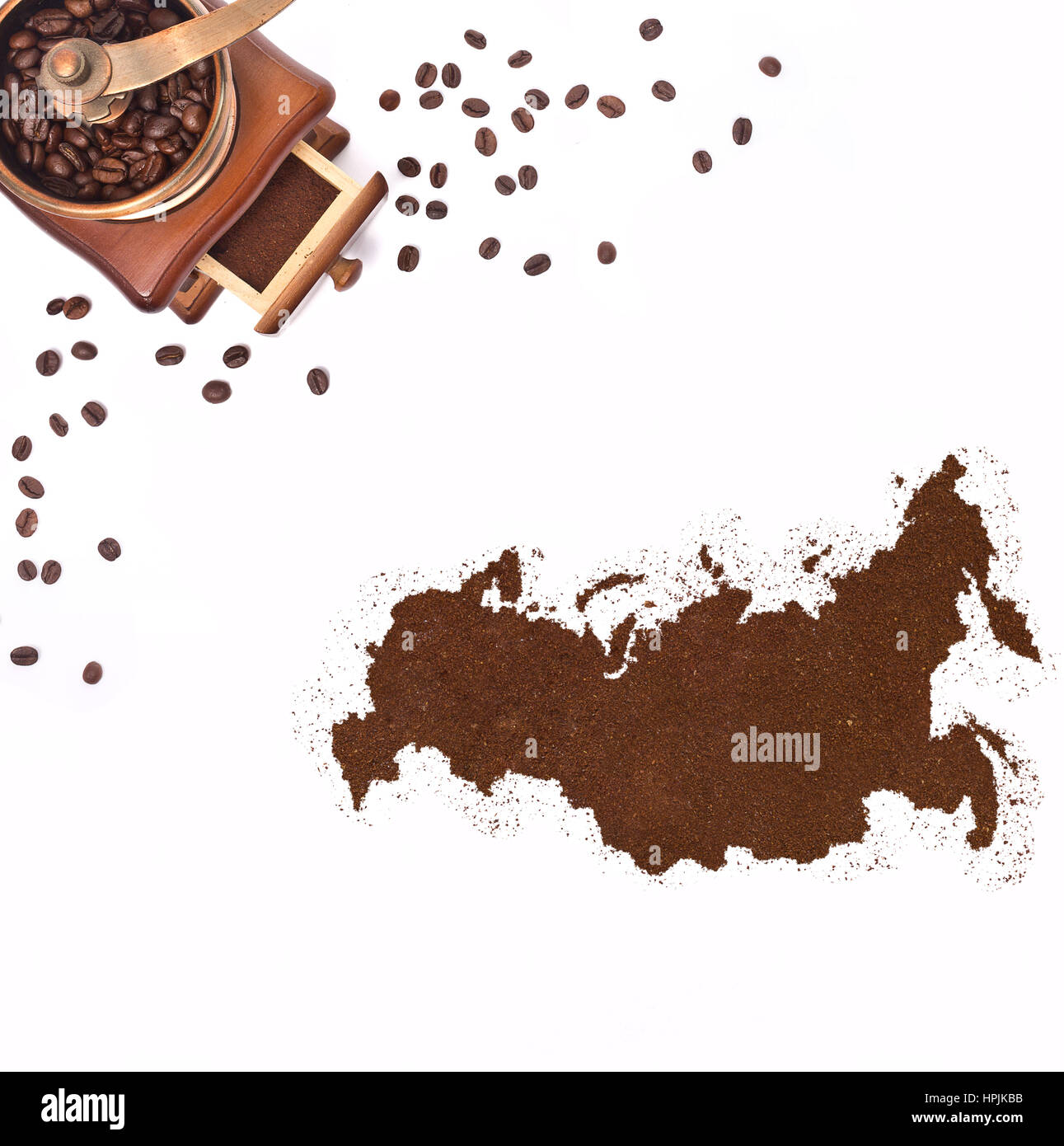 Coffee powder in the shape of Russia and a decorative coffee mill ...
