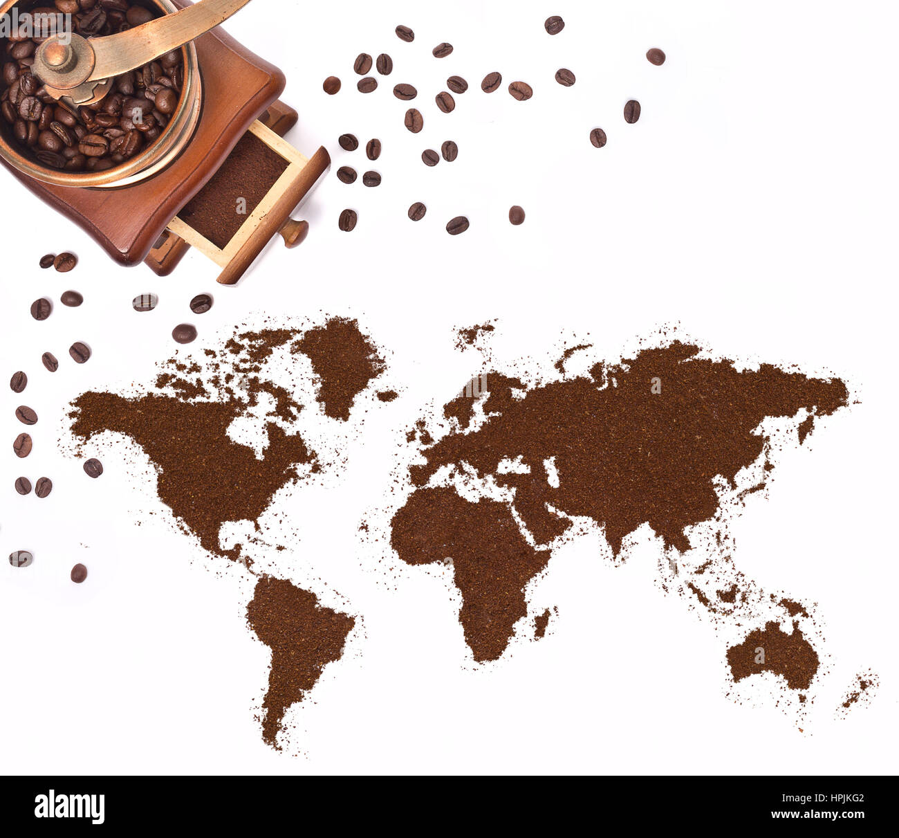 Coffee powder in the shape of the world and a decorative coffee mill ...