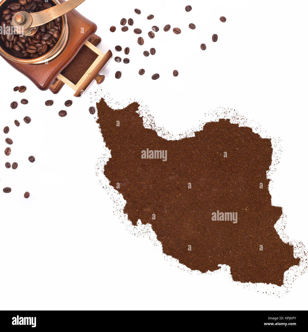 Coffee powder in the shape of Iran and a decorative coffee mill.(series ...