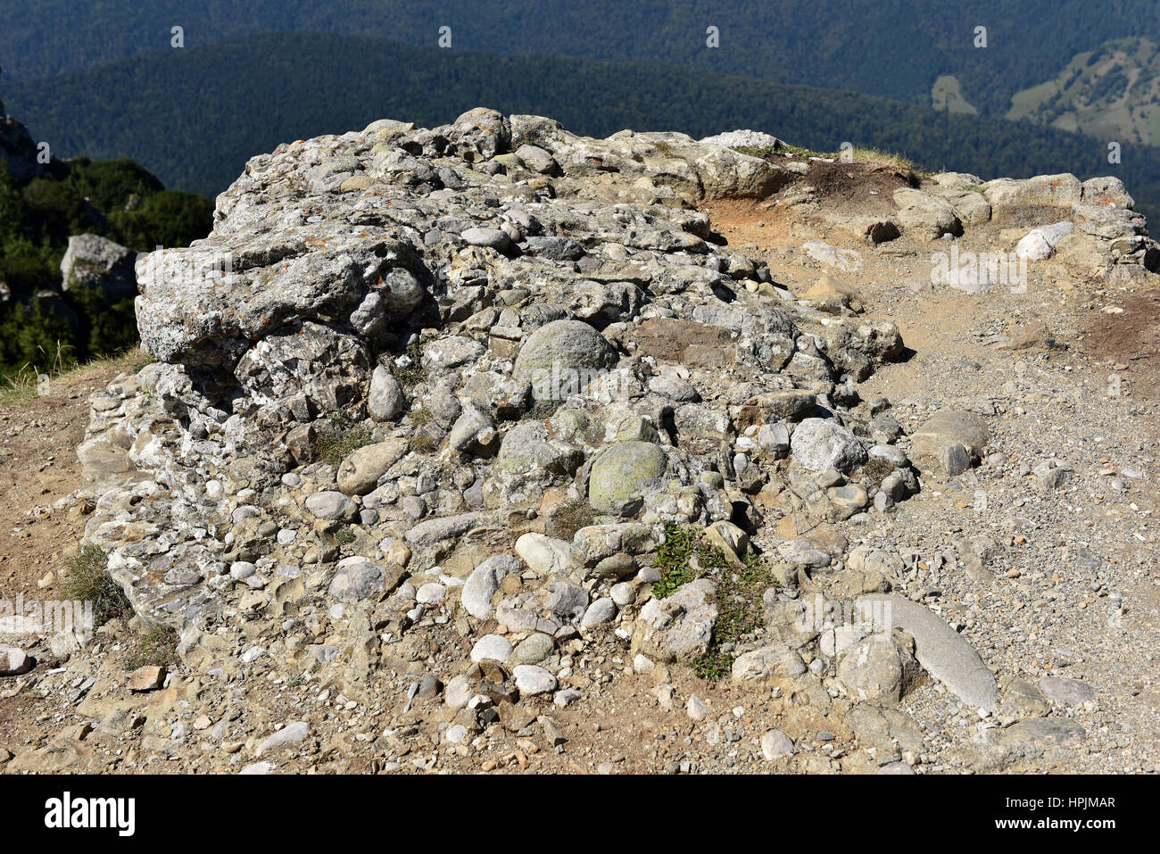 Texture of conglomerate rock with gravel, clasts and pebbles. Ceahlau ...
