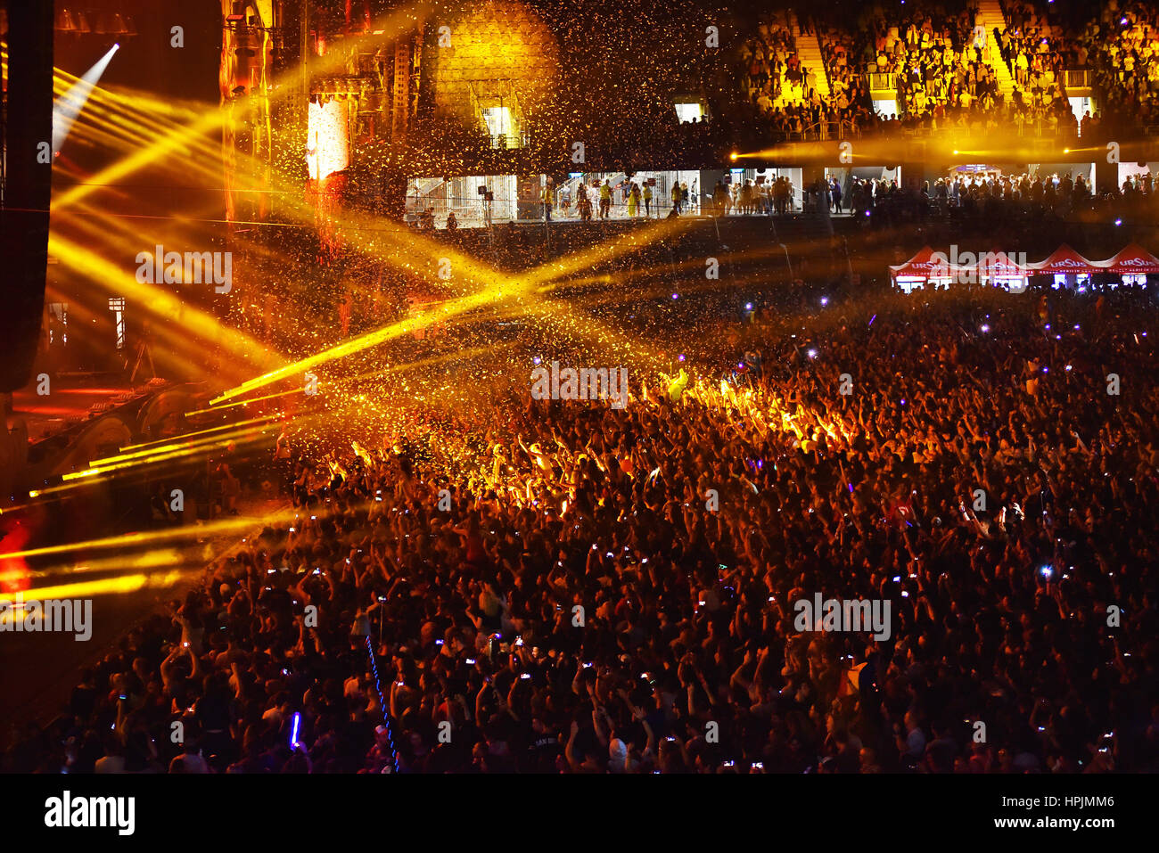 CLUJ-NAPOCA, ROMANIA - AUGUST 7, 2016: Confetti cannons throwing confetti from the stage over ...