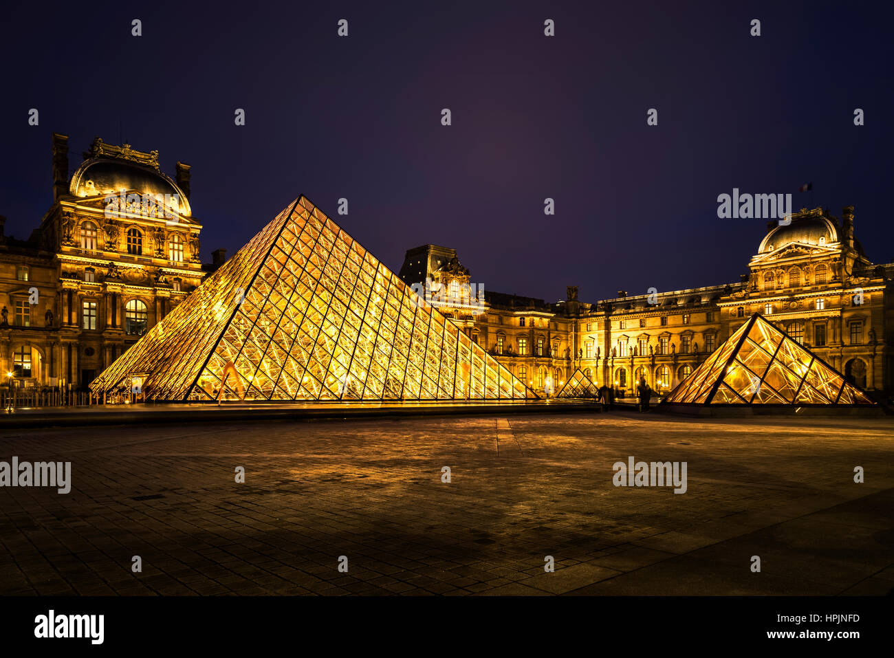 Louvre Museum at Night Stock Photo - Alamy