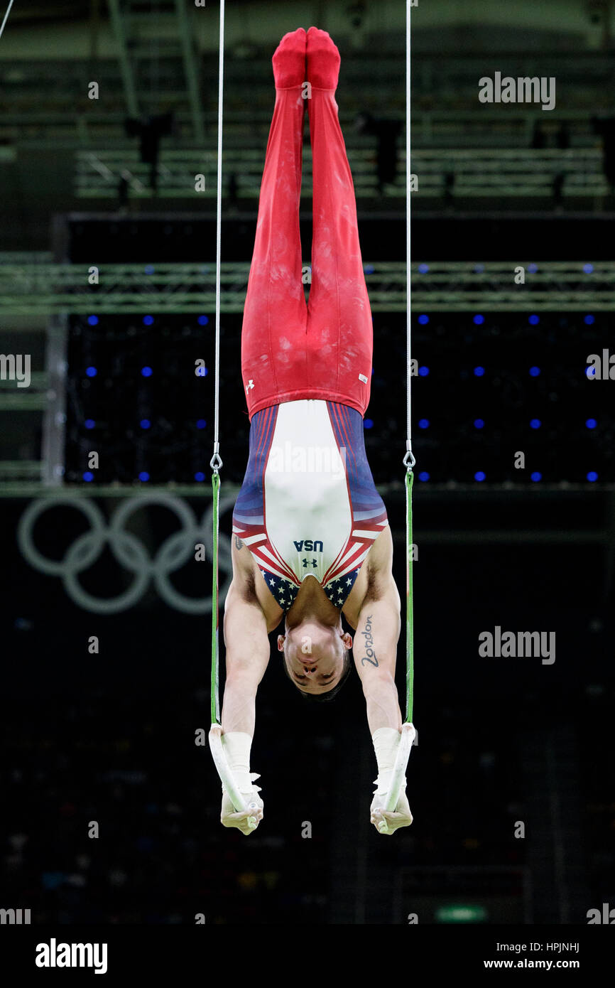 Male gymnast on rings hi-res stock photography and images - Alamy