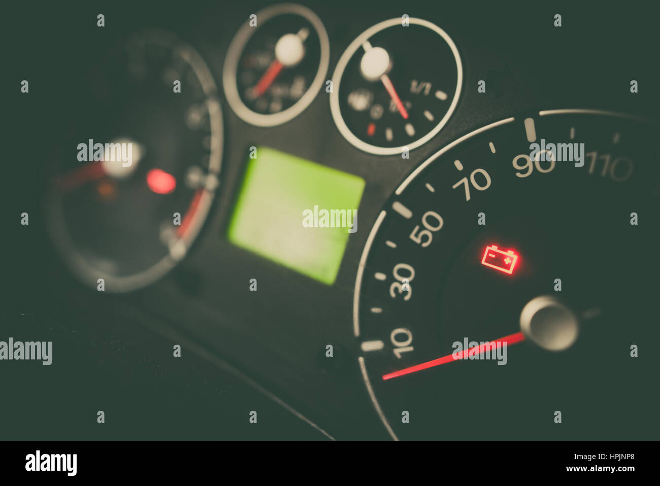 Close up shot of a car's dashboard with the battery icon lit Stock ...