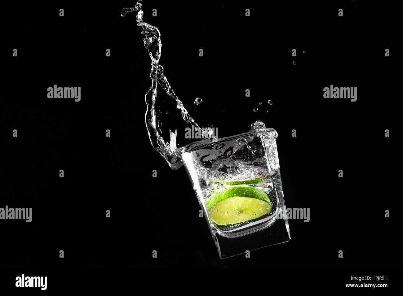Lime is falling in the water isolated on black background Stock Photo ...
