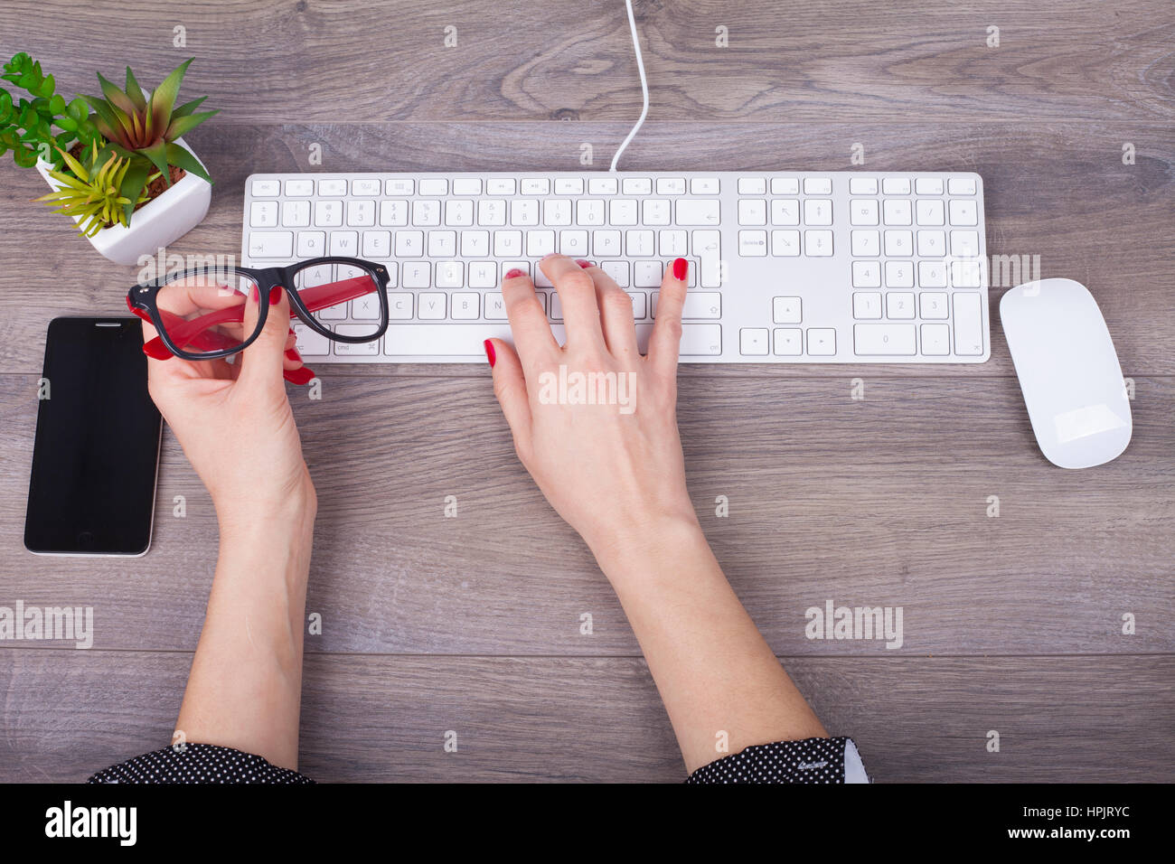 Close-up of typing female hands on keyboard from above Stock Photo - Alamy