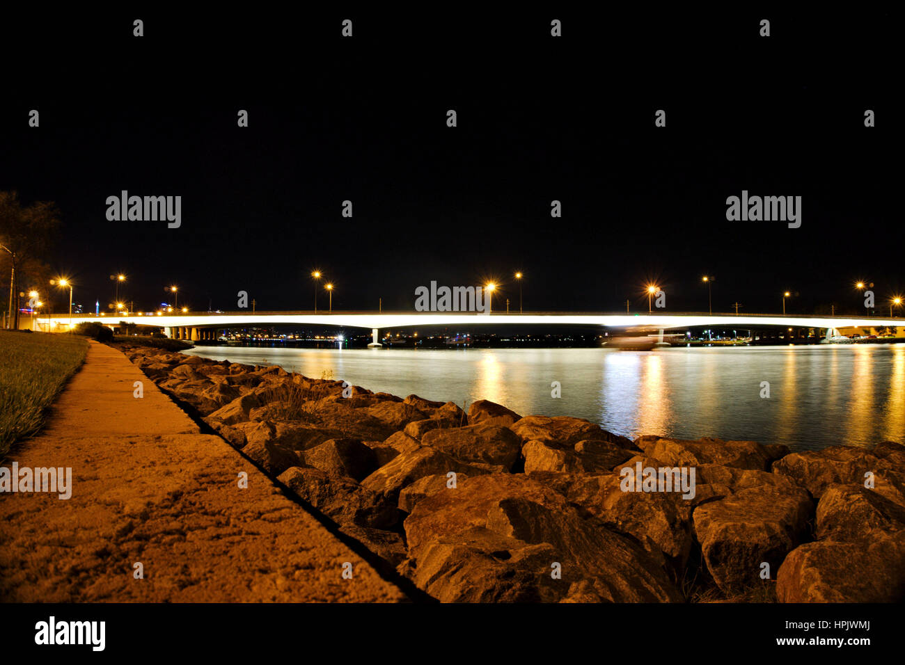 Night scene of a river in a city Stock Photo - Alamy
