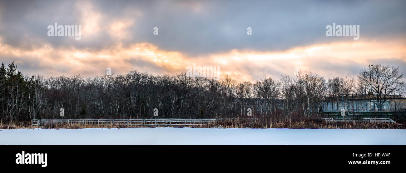 winter panoramic Albro lake covered by snow with withered grasses in ...