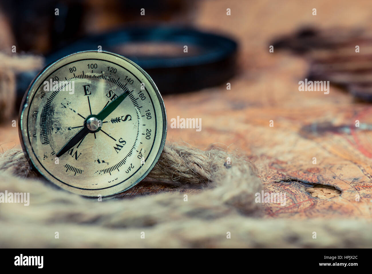 Columbus day and world map with compass Stock Photo - Alamy