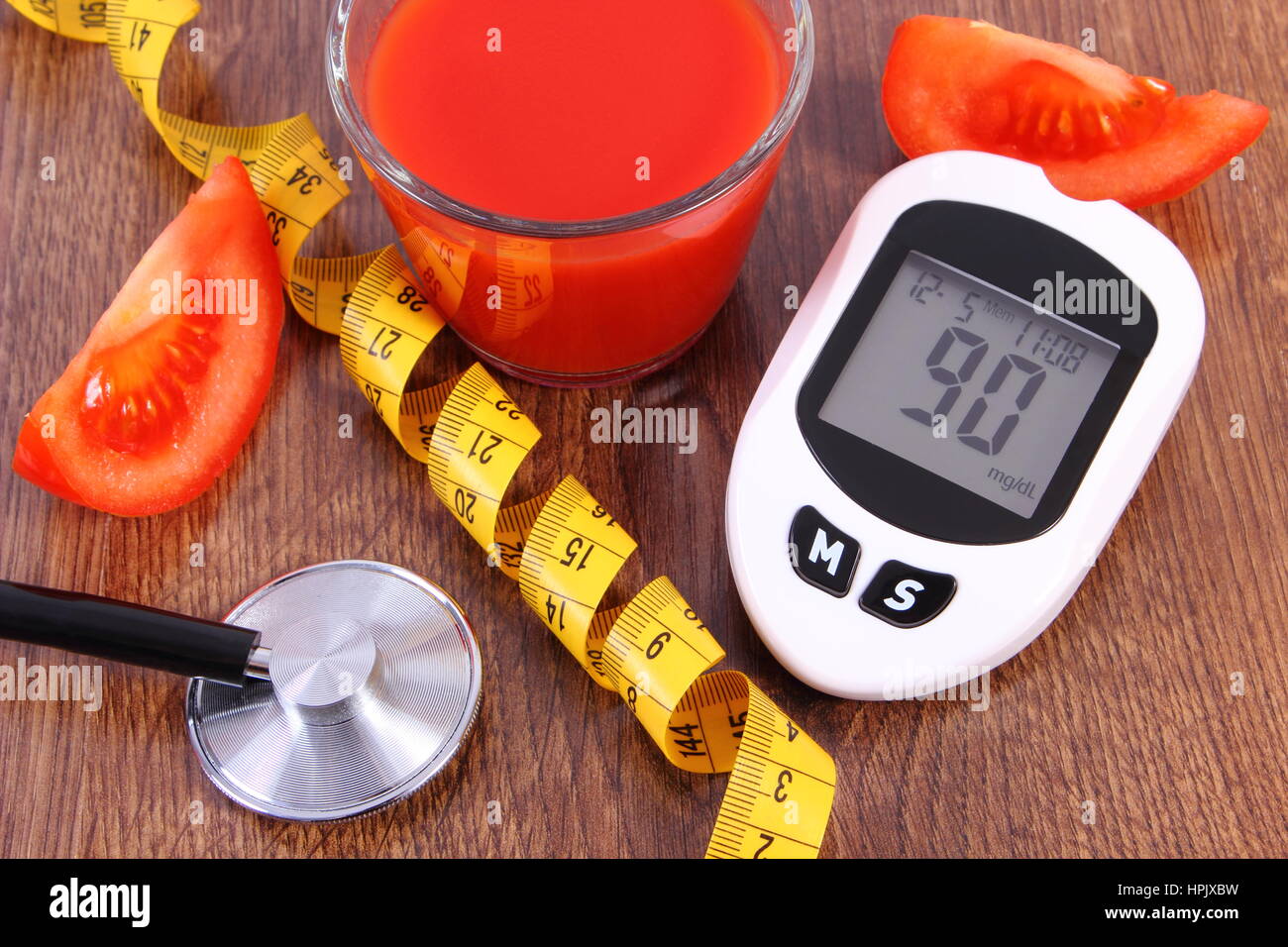 Glucose meter with good result sugar level, tape measure and fresh ...