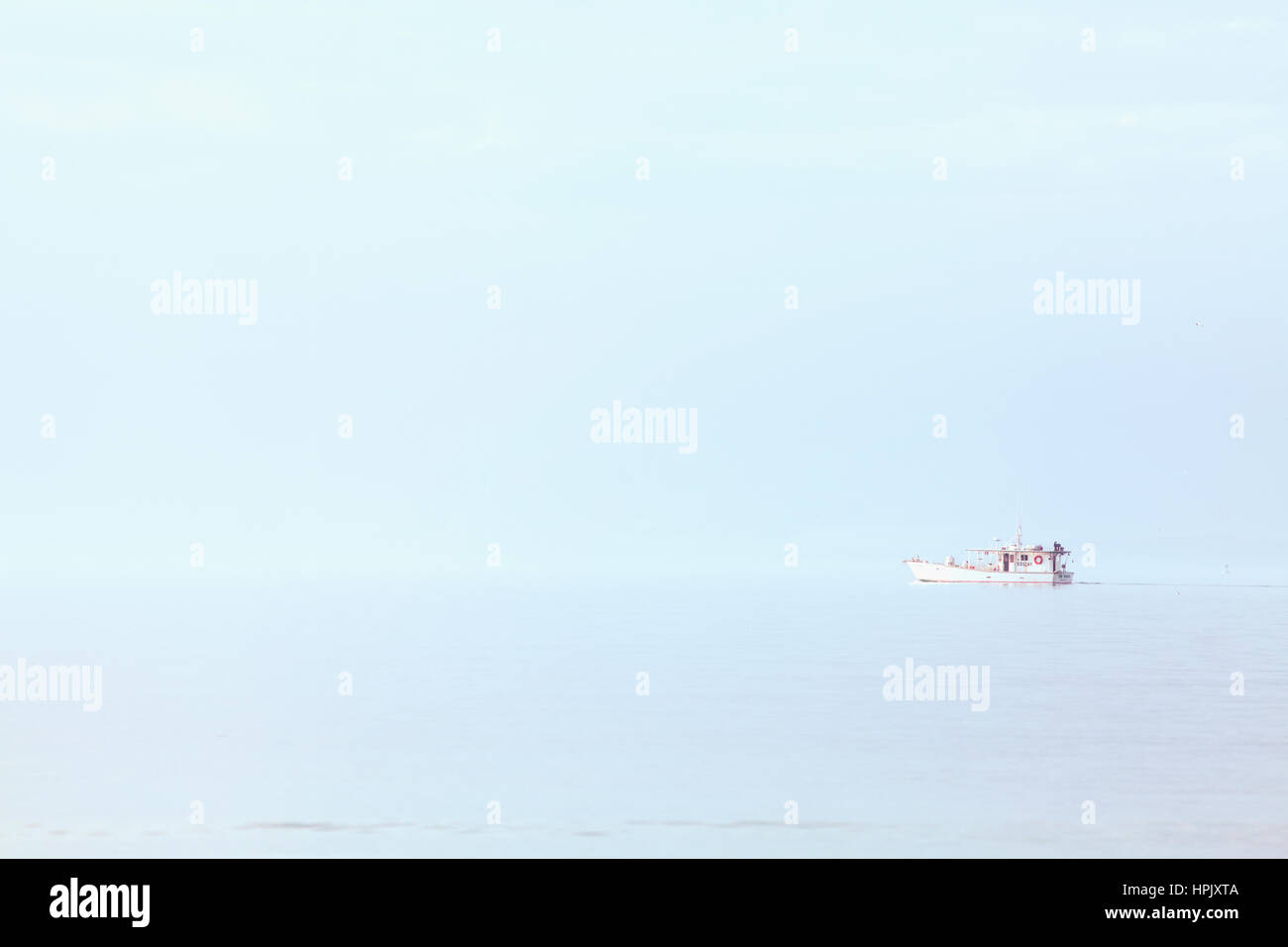 Small boat distance hi-res stock photography and images - Alamy