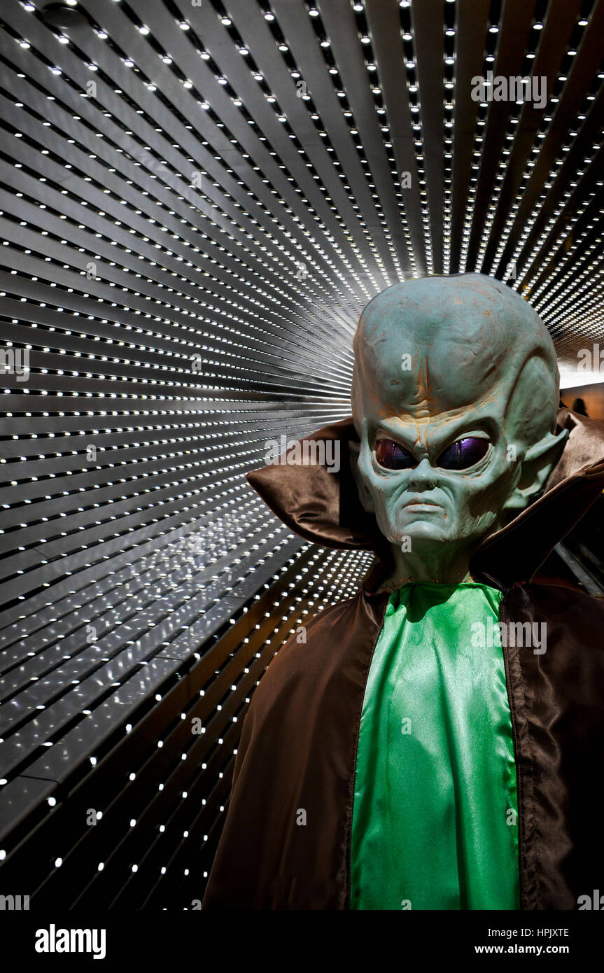 Alien in a lighted corridor Stock Photo - Alamy