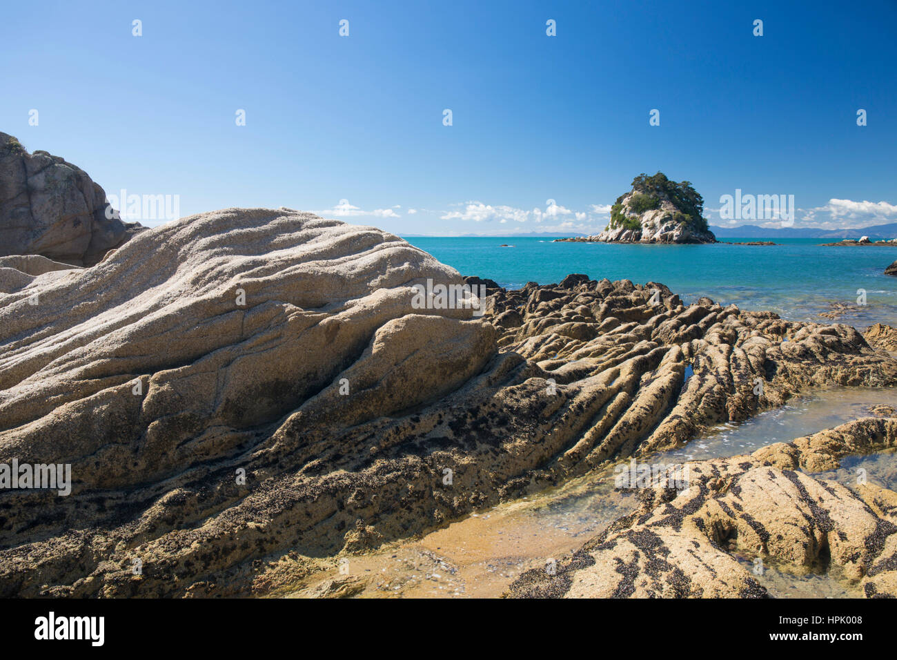 Kaiteriteri, Tasman, New Zealand. View across Tasman Bay from rocky ...