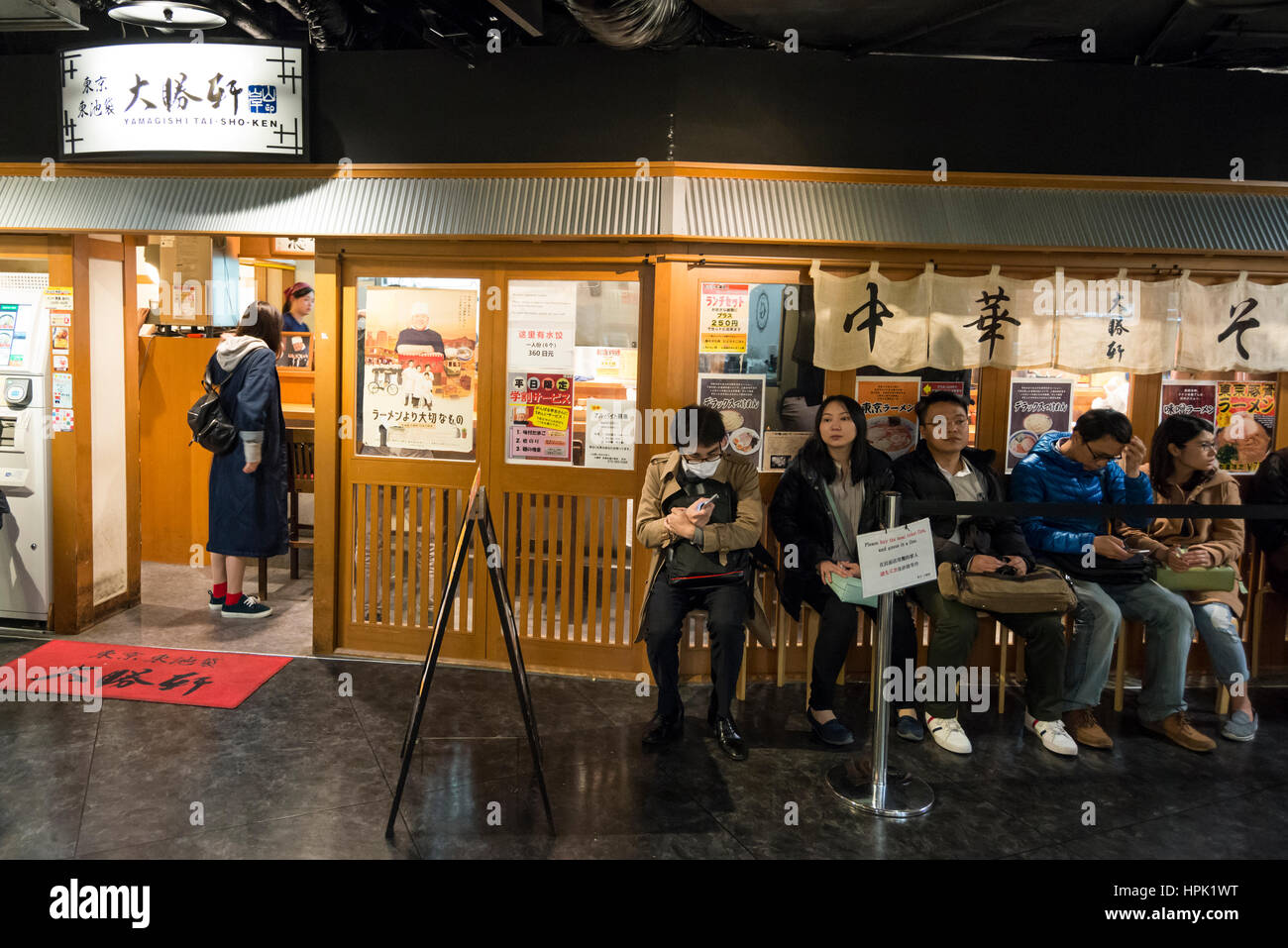 People waiting for tables to become available outside of a budget ...