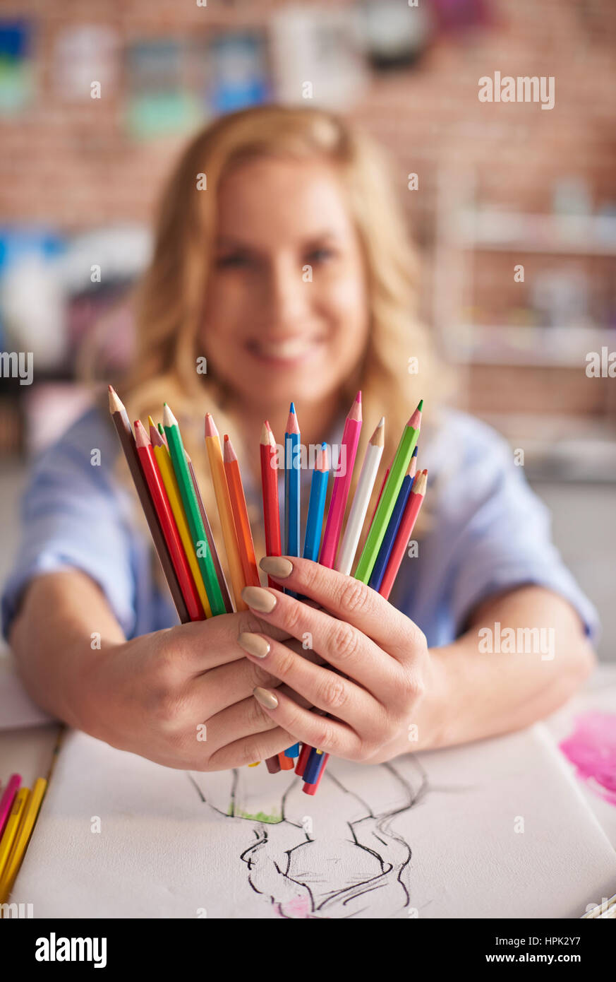 Woman showing her colorful equipment Stock Photo - Alamy