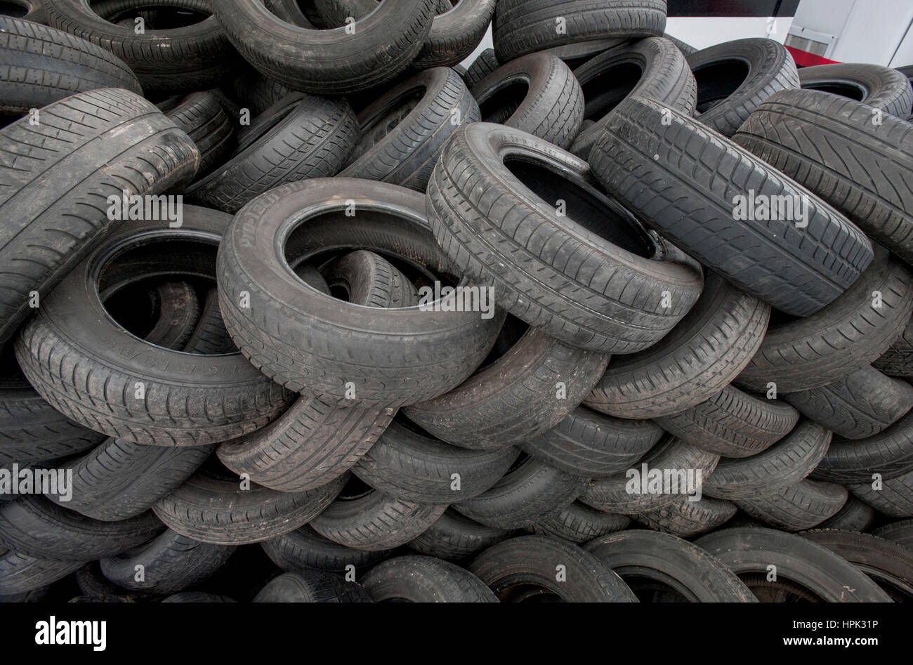 Stack of worn out, used up car tyres Stock Photo - Alamy