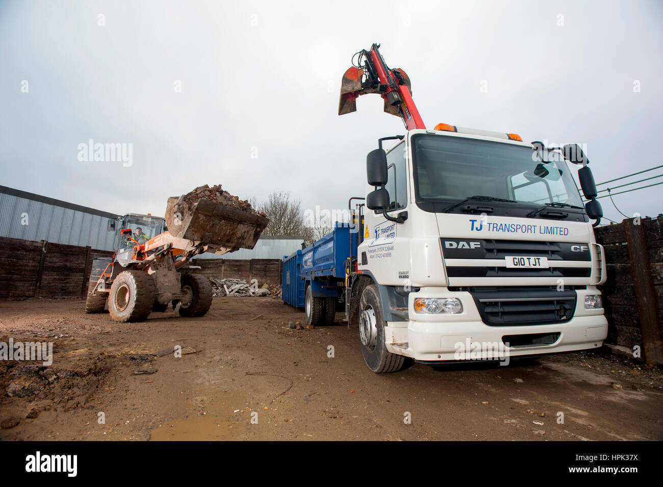 Front loader excavator working Stock Photo - Alamy