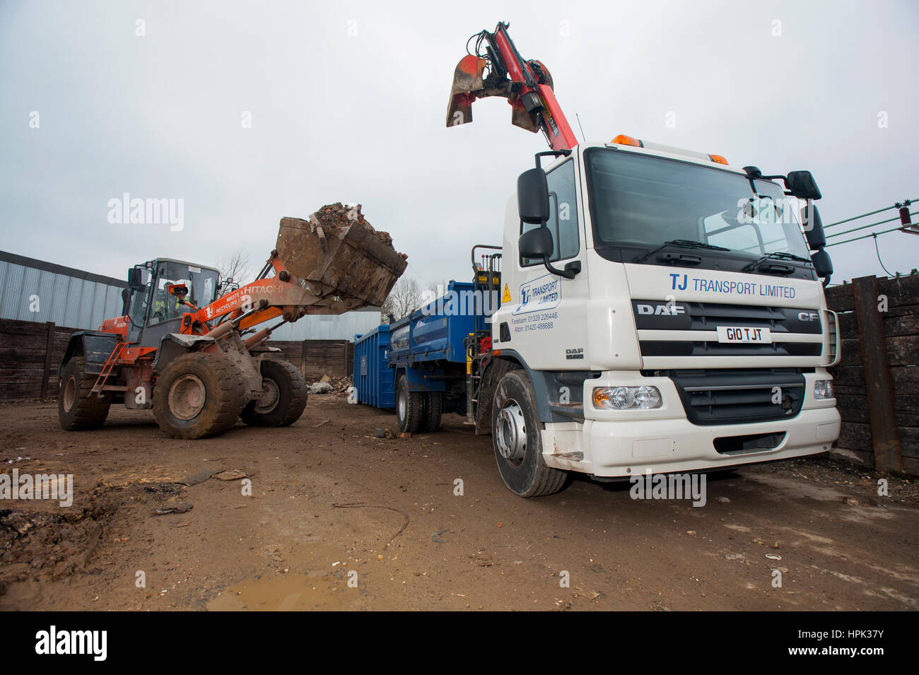 Front loader excavator working Stock Photo - Alamy