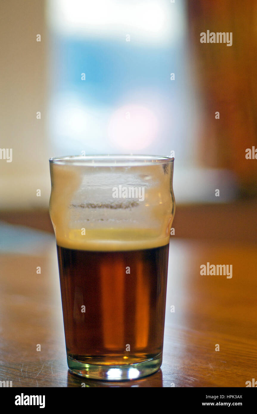 Half empty glass of beer Stock Photo - Alamy