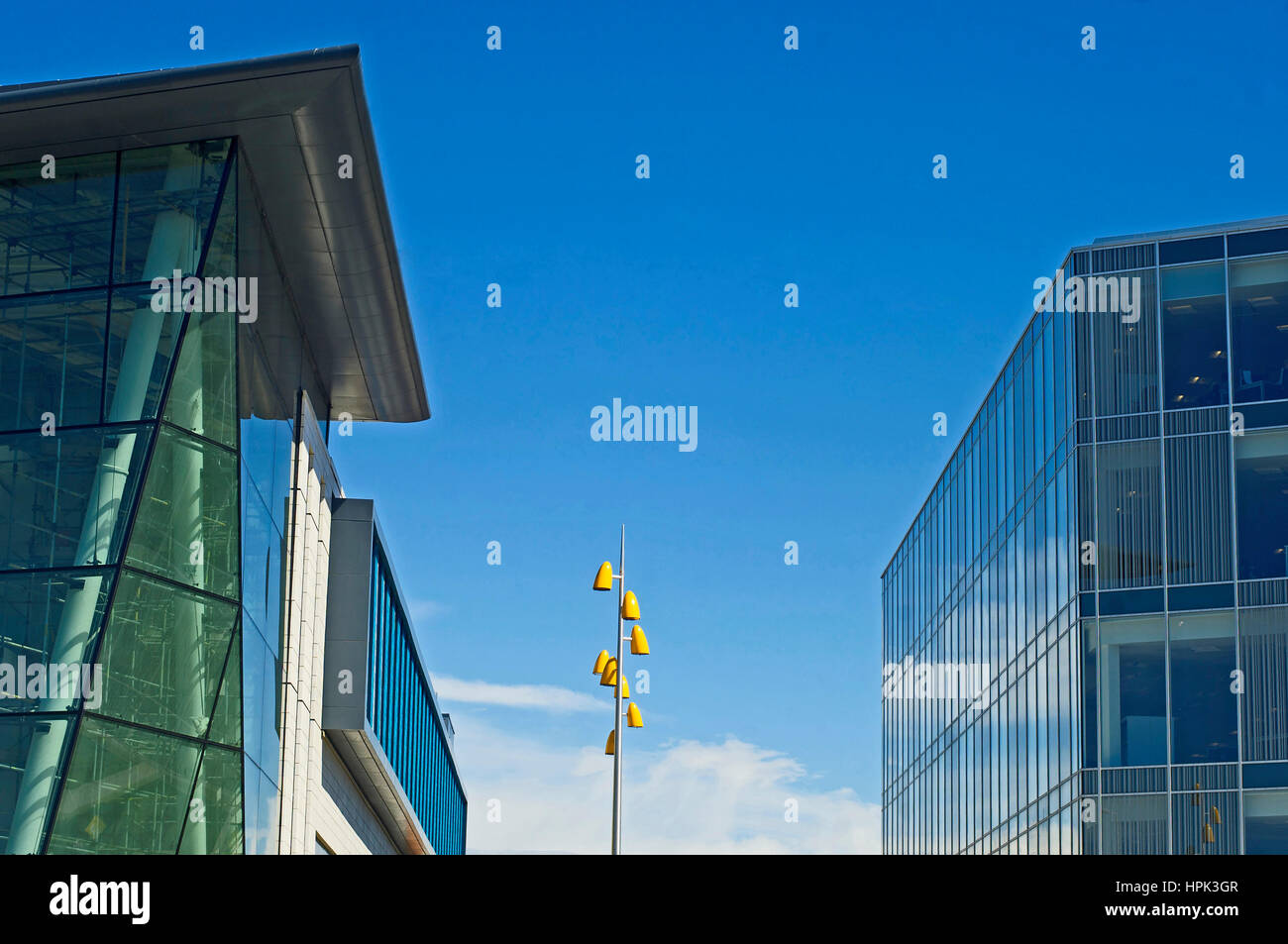 Yellow lamp post in modern cityscape Stock Photo - Alamy