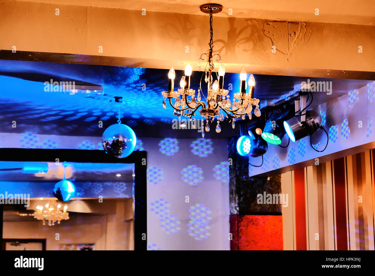 Chandelier and disco lighting at night club Stock Photo - Alamy